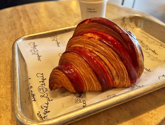 Strawberry Croissant: Buttery layers of perfection that shatter with each bite &ndash; leaving evidence of your indulgence everywhere and regrets nowhere.