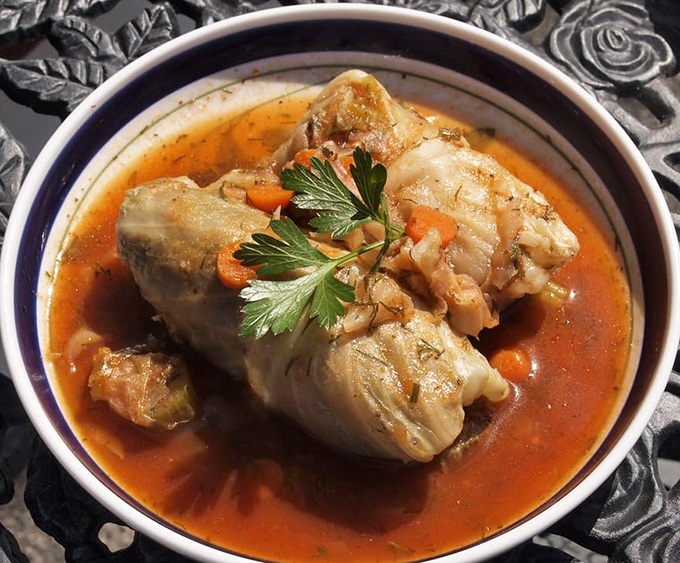 Tender cabbage embracing a savory filling, swimming in tomato broth that begs to be sopped up with crusty bread.
