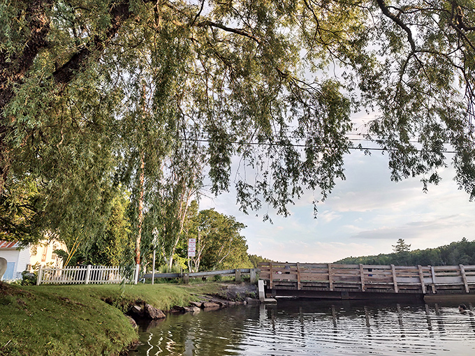 Summer transforms the bridge into a community gathering spot, where locals and visitors share stories across sun-dappled waters.