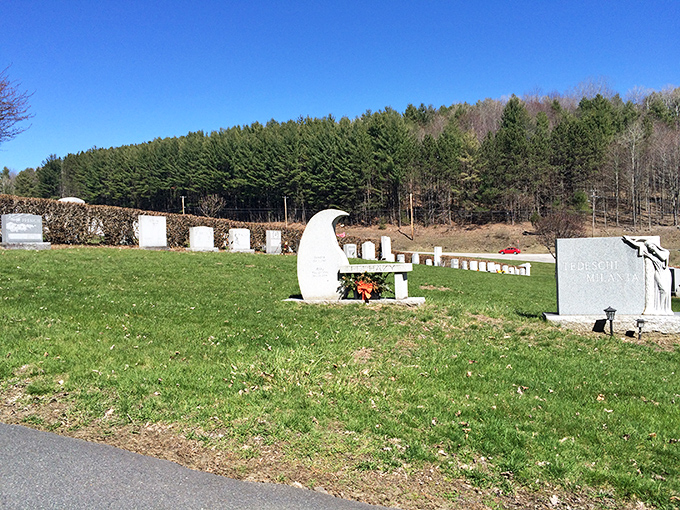 Summer sunlight illuminates rows of monuments, where personal stories are told through stone in this outdoor gallery of remembrance.