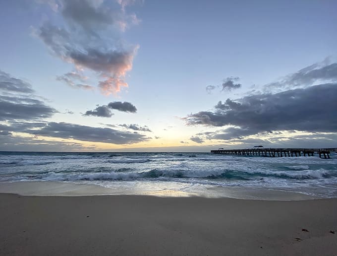 Golden hour magic as day bids farewell at Lake Worth Beach. The kind of sunset that makes smartphone cameras work overtime.