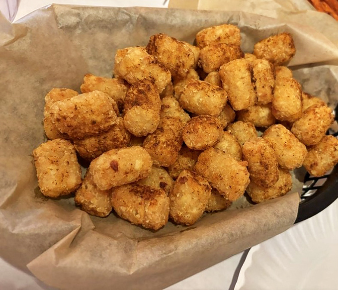 These aren't your school cafeteria's tater tots. These golden nuggets are crispy, seasoned perfection—the ideal vehicle for sopping up every last drop of sauce.