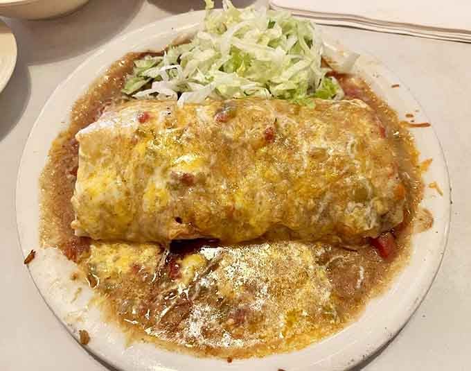 These enchilada-style burritos arrive dressed to impress, topped with enough cheese and garnishes to make your heart sing with joy.