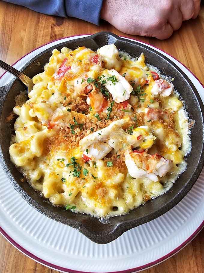 Lobster mac and cheese in a skillet is the kind of indulgence that makes salads weep with envy.