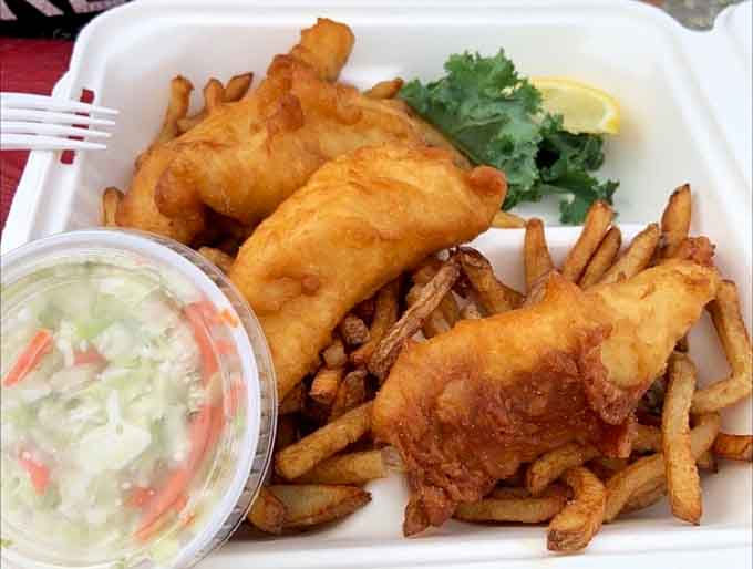 Fish and chips done right: flaky white fish in a light, crispy batter that would make any British pub jealous, served with perfectly seasoned fries.