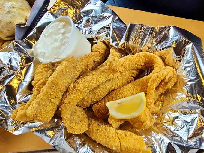 Golden fried fish that would make any fish fry jealous, served with fries and all the fixings.
