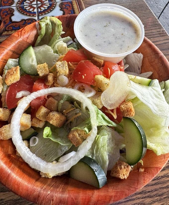 Fresh vegetables arranged like edible art, proving that even in a burger palace, salads get the respect they deserve.