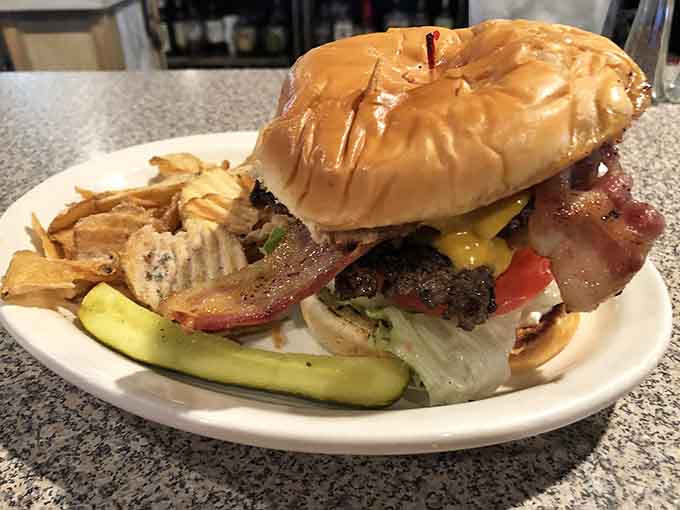 This bacon cheeseburger is stacked so high it requires a strategic eating plan, and honestly, that's exactly how burgers should be.