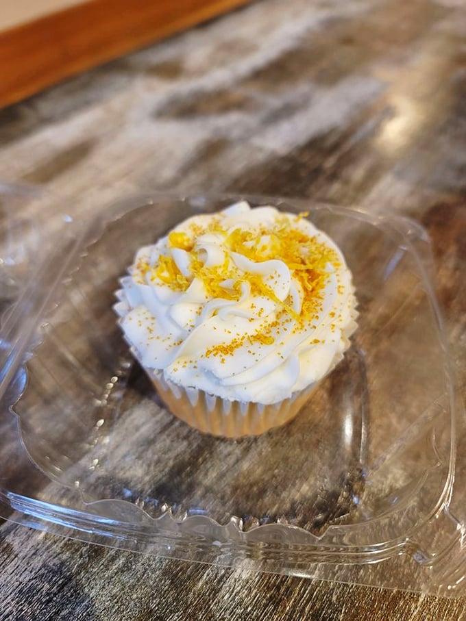 Sweet, tangy perfection: The vegan lemon curd cupcake with its delicate gold dusting proves plant-based desserts can outshine their traditional counterparts.