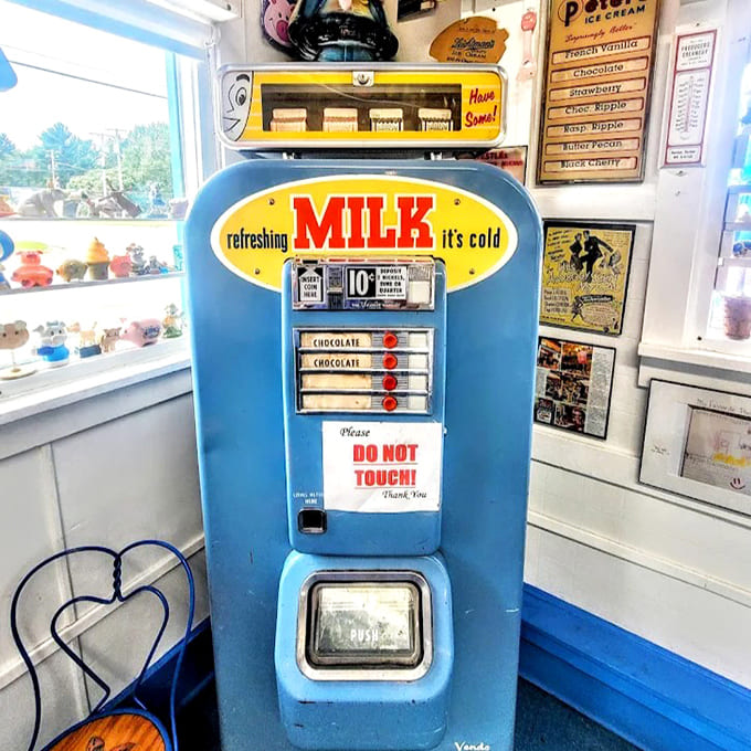 This blue sentinel of dairy history stands watch, a chrome-trimmed reminder of when milk delivery was high technology and ice cream was special.