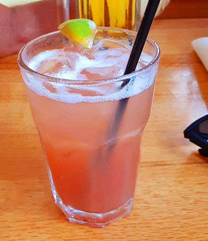 A watermelon margarita that tastes like summer vacation in a glass. The lime wedge isn't garnish &ndash; it's punctuation on a perfect sentence.
