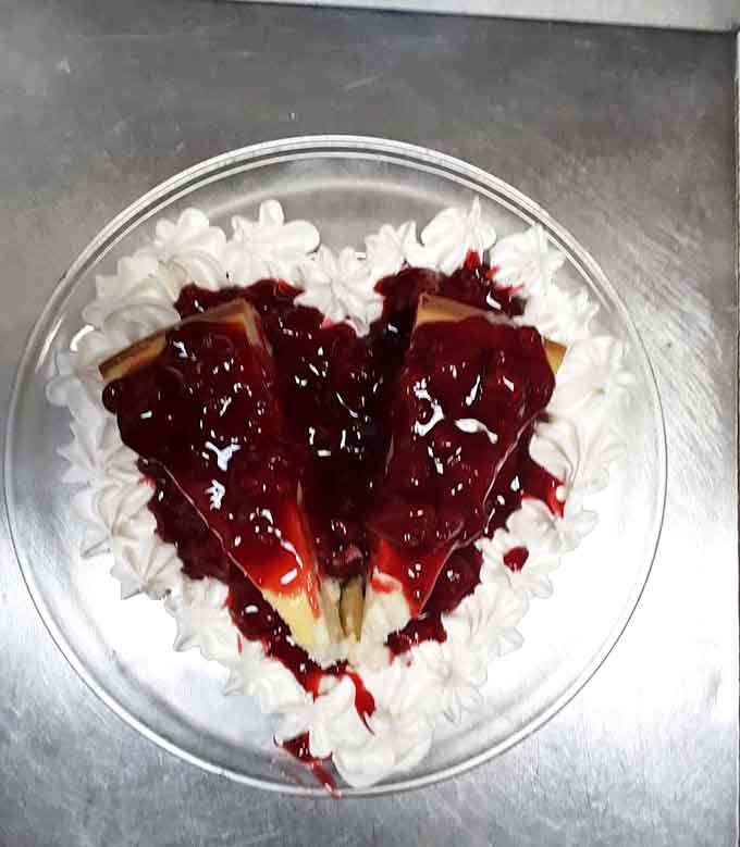 This cherry-topped cheesecake slice demonstrates that saving room for dessert is always the right decision, regardless of how full you feel.