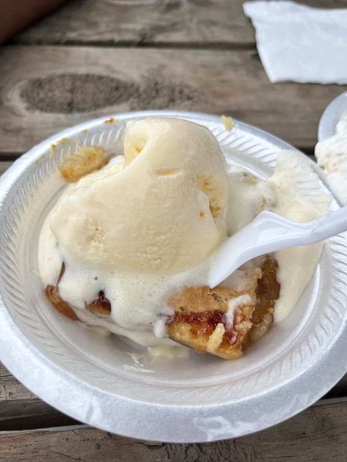 Warm peach cobbler topped with vanilla ice cream melting into golden perfection is the kind of dessert that makes diets seem irrelevant.