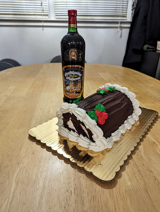 Wine: The perfect holiday pairing! This traditional gl&uuml;hwein bottle stands guard over a chocolate log cake worthy of celebration.