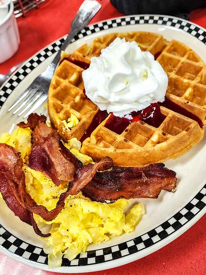 The Belgian waffle combo is breakfast done right, with crispy waffles, fluffy eggs, and bacon that knows its purpose in life.