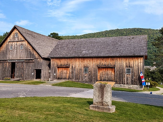 The weathered barn stands as a testament to agricultural ingenuity, its wooden beams having witnessed generations of Vermont farming traditions.