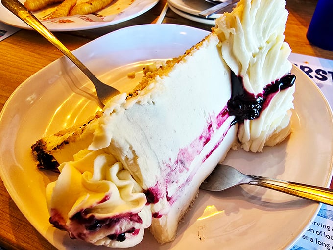 Blueberry pie with that perfect balance of sweet and tart, showcasing Maine's famous wild berries in their most delicious possible form.