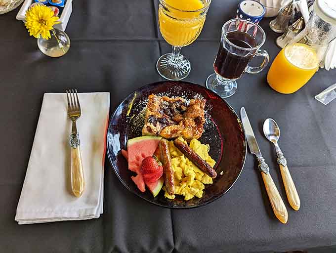 Breakfast perfection: scrambled eggs, bacon, and potatoes that remind you why morning meals should never be skipped.