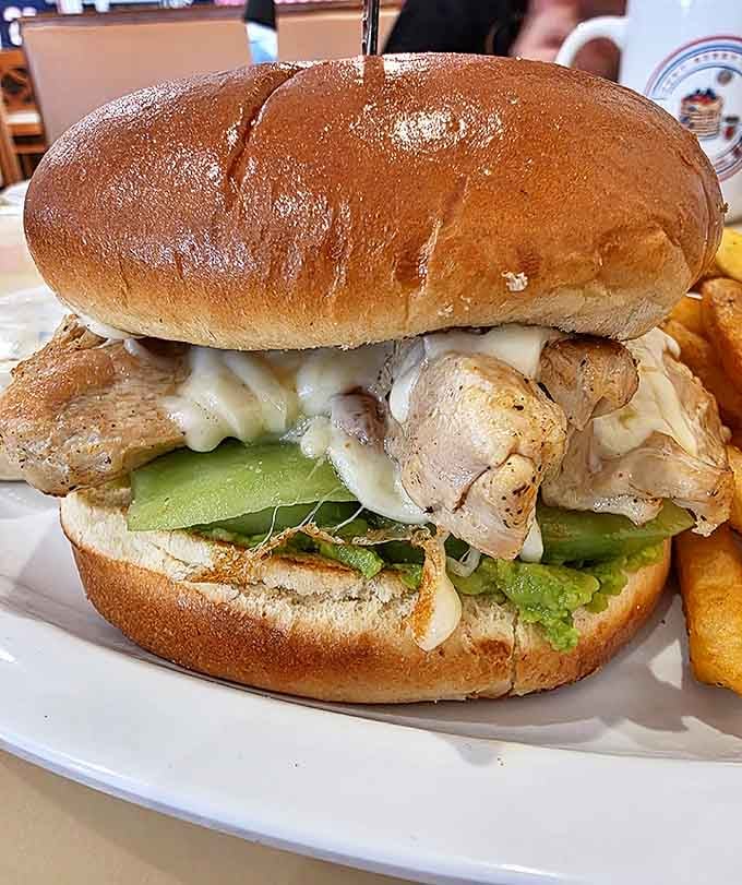 Ladies and gentlemen, meet the burger of your dreams. It's so tall, it needs its own area code!