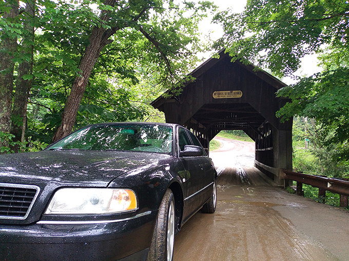 A modern vehicle prepares to enter Emily's domain, perhaps unaware that some cars emerge with unexplained scratches along their sides.