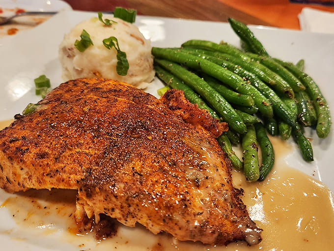 Perfectly seasoned chicken breast meets vibrant green beans in a plate that proves healthy eating doesn't have to sacrifice an ounce of flavor.