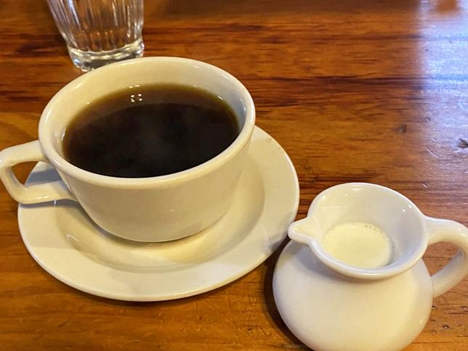 Coffee served in sturdy mugs that warm your hands while you plan your Vermont adventures between bites of breakfast.