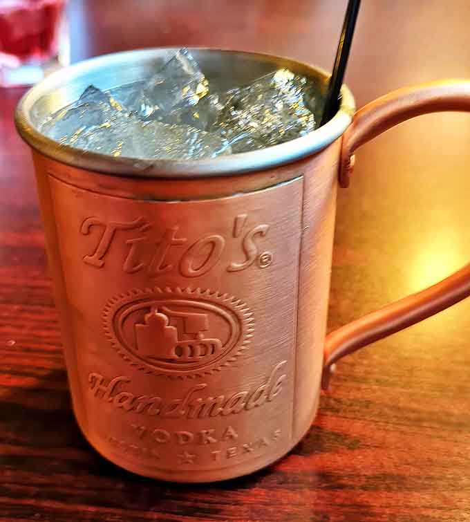 Tito's Moscow Mule served in a traditional copper mug &ndash; the ideal refreshment between bites of hearty pub fare.