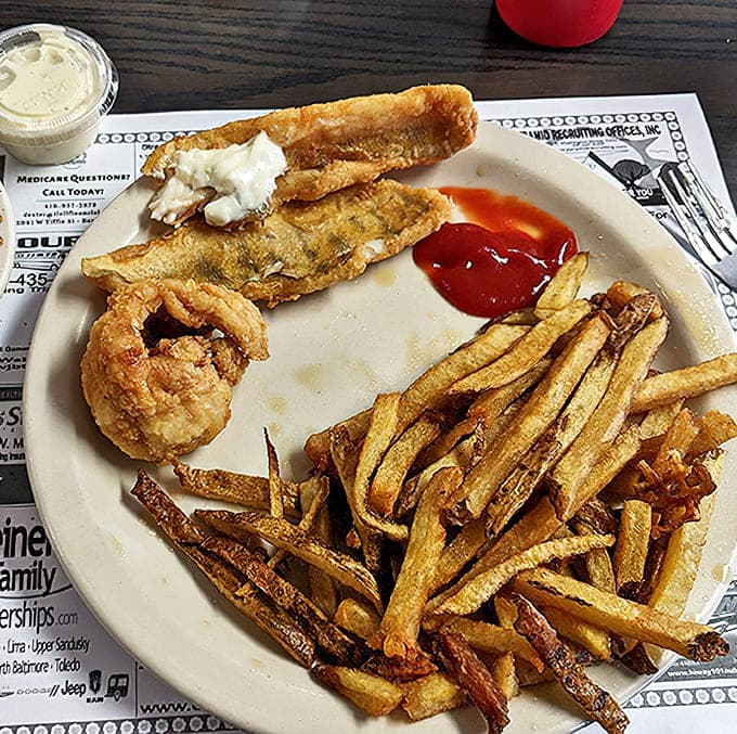Golden-fried fish with a light, crispy coating that doesn't overwhelm the delicate flavor, served with hand-cut fries that put chains to shame.