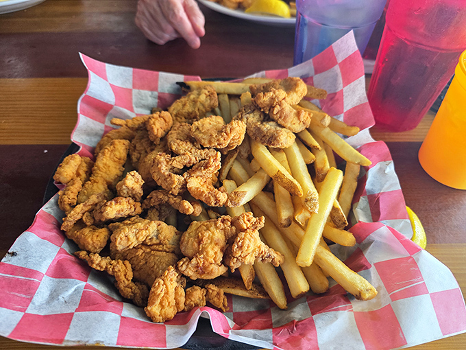 Golden-fried shrimp nestled against crispy fries &ndash; comfort food with a coastal accent that satisfies something primal in your seafood-loving soul.