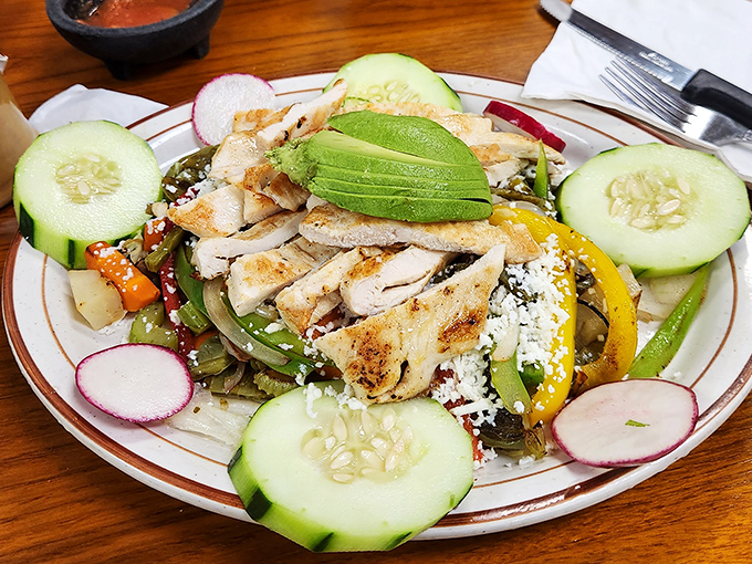A refreshing chicken salad that proves La Quebrada's expertise extends beyond their famous grilled meats to lighter, vibrant options.
