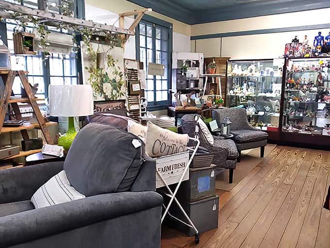 Narrow pathways lead to unexpected discoveries as shelves overflow with nostalgic treasures, each item whispering stories from its previous life.