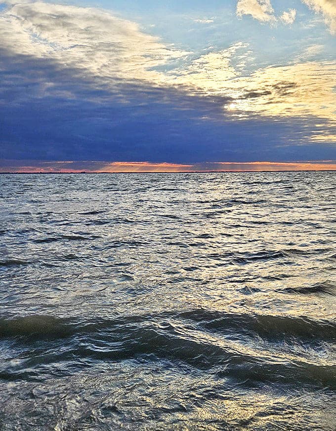 Where earth meets sky: Lake Erie's horizon line draws the eye toward infinity, a meditation point that makes everyday worries seem delightfully insignificant.