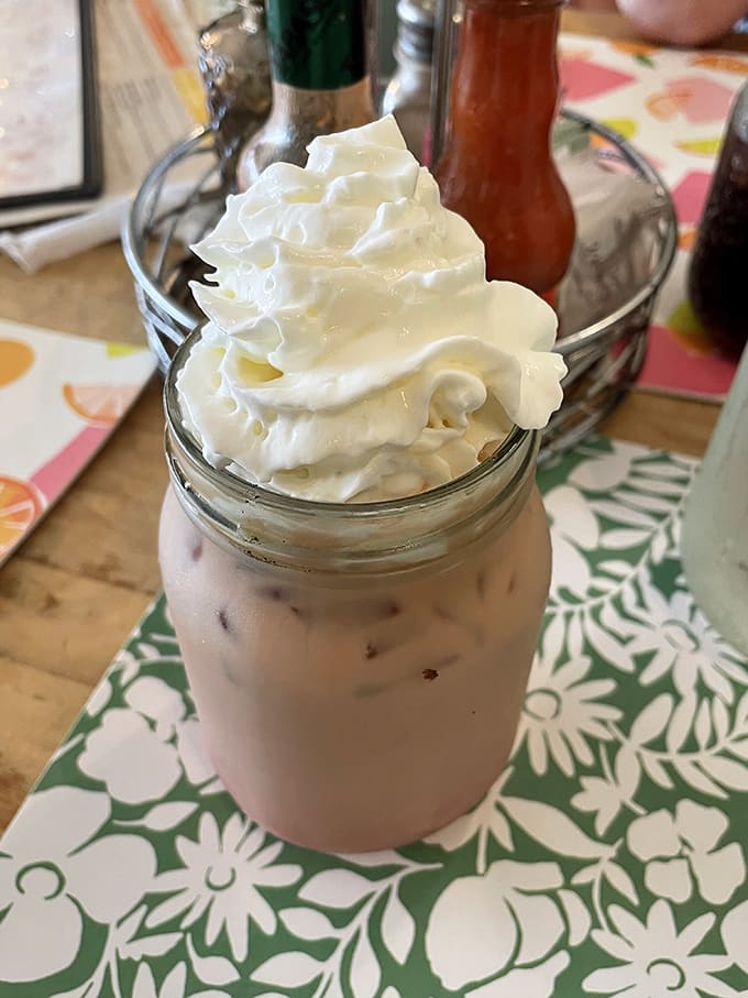Iced Mocha: A mason jar mountain of caffeinated delight, topped with whipped cream that defies gravity and common sense.