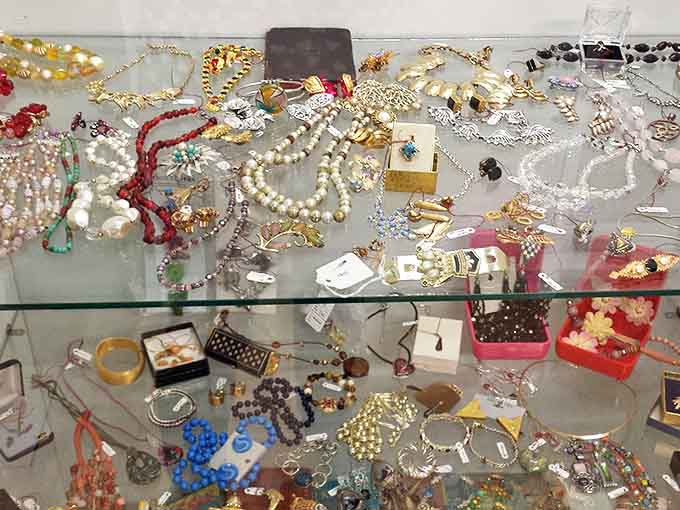 Glittering costume jewelry spans decades of fashion history, from Victorian-inspired pieces to bold mid-century statement accessories.