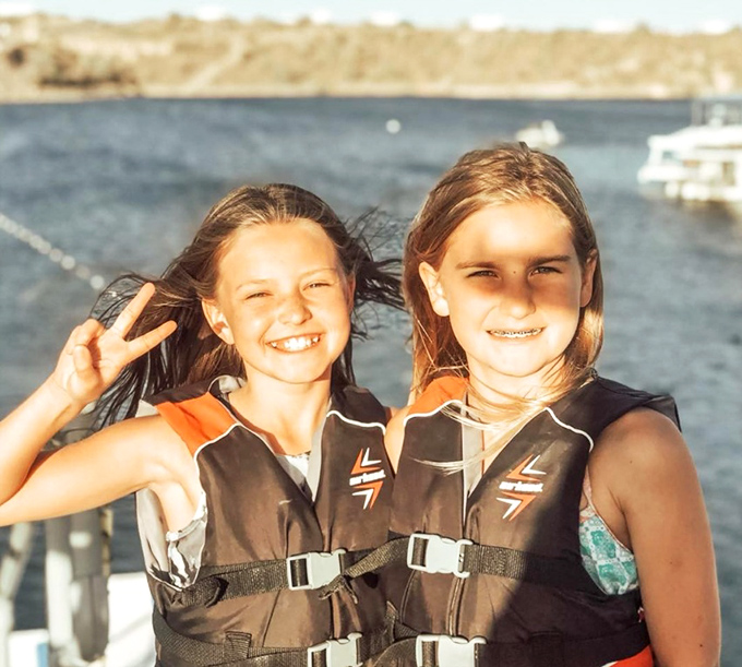 Young visitors flash victory signs after conquering the slide &ndash; tomorrow's daredevils building courage one splash at a time.