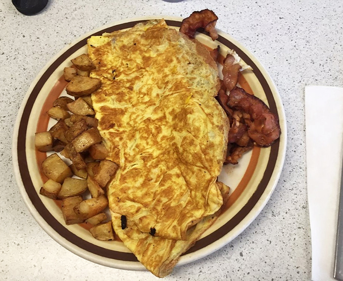 Folded to perfection and paired with those legendary home fries &ndash; this omelet contains everything except pretension.