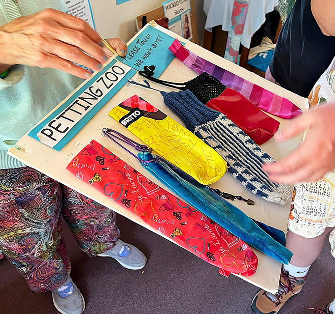 The "Petting Zoo" section allows hands-on interaction with various umbrella covers &ndash; tactile education at its most unexpected.