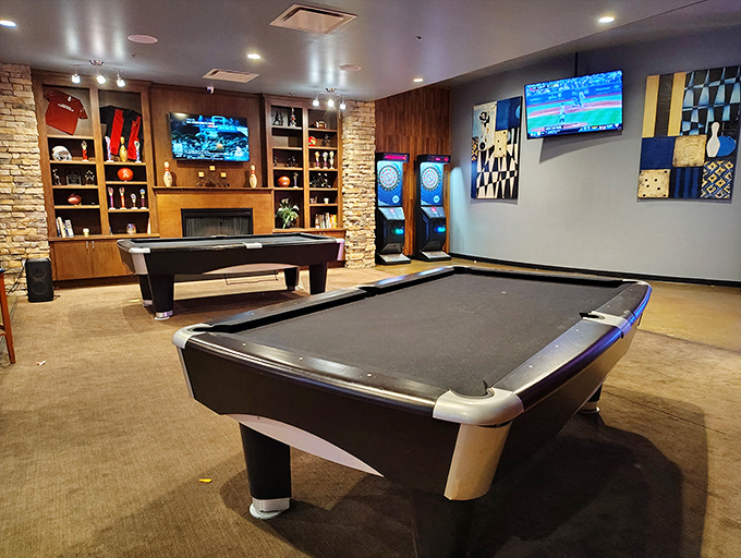 Billiards heaven awaits in this sophisticated gaming space where precision shots happen amid warm lighting and comfortable lounge-style seating.