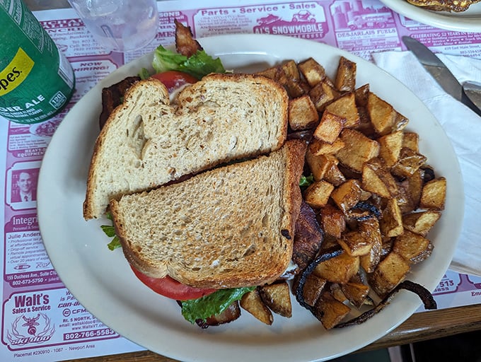 A sandwich that means business, paired with potatoes that have achieved that magical caramelized exterior only time can create.