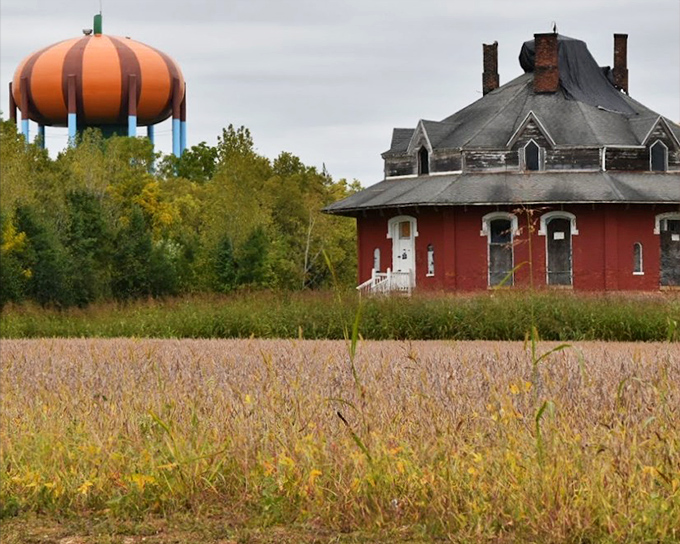 Morning light accentuates the tower's ridged design, showcasing the attention to detail that makes this more than just an orange sphere.