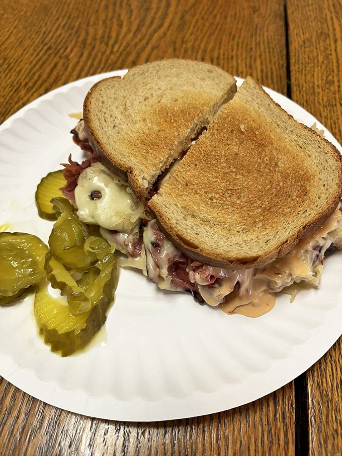 Reuben revelation: melted Swiss cascades over corned beef and sauerkraut, creating that perfect tangy-savory balance that defines sandwich greatness.
