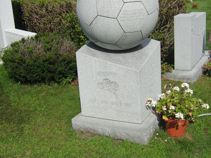 This perfectly carved granite soccer ball celebrates a passion for the beautiful game, its hexagonal pattern showcasing the carver's mathematical precision.