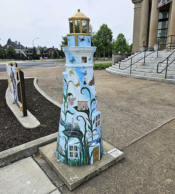This whimsical lighthouse stands guard outside, its painted butterflies and scenes suggesting even nautical beacons deserve a touch of carousel magic.