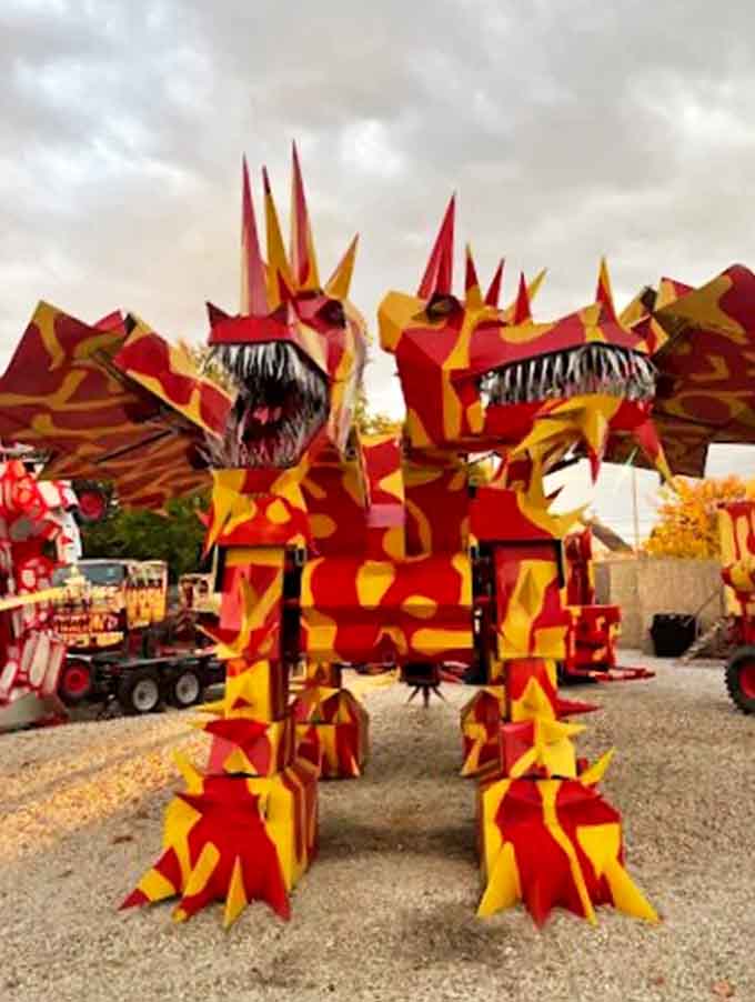 Up close, the dragon's intricate metalwork reveals countless hours of craftsmanship, with jagged teeth that seem ready to snap at any moment.