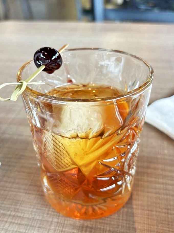This Old Fashioned isn't just a drink, it's a time machine &ndash; Woodford Reserve, sugar cube, and Luxardo cherry creating liquid nostalgia.