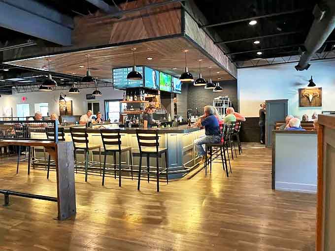 The bar area invites lingering conversations over craft beers and cocktails, where strangers become friends over shared food recommendations.
