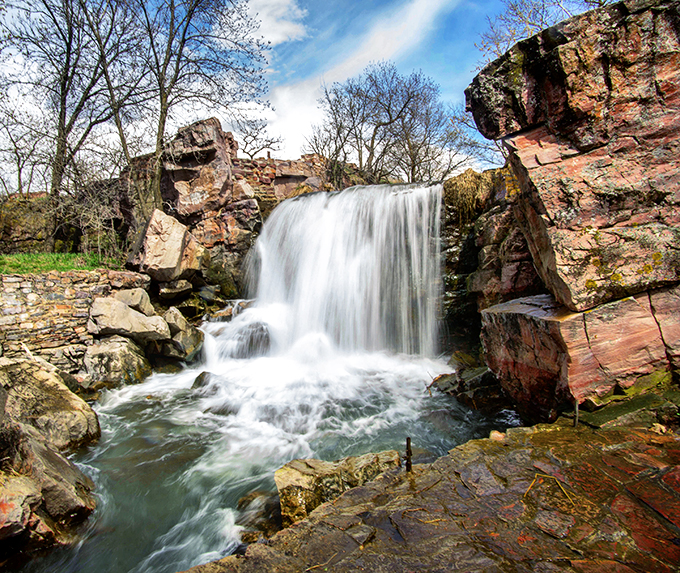 Red rock runway! Winnewissa Falls struts its stuff over quartzite, proving even water can be fashion-forward.