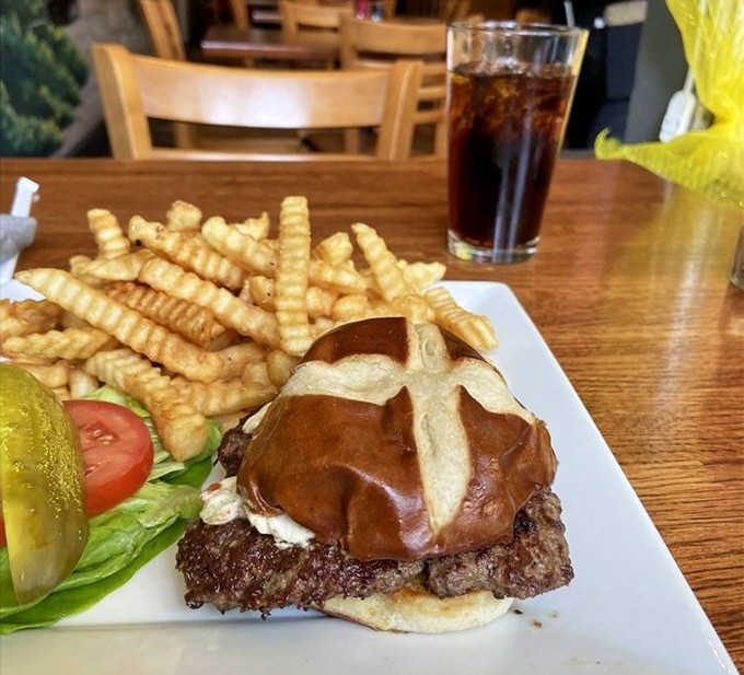 A burger that doesn't need gimmicks, just perfectly seasoned beef, melty cheese, and crinkle-cut fries that disappear mysteriously fast.