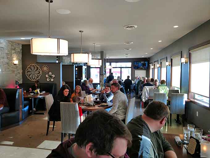 The dining room buzzes with happy conversations and the kind of energy that only comes from people enjoying really good food.