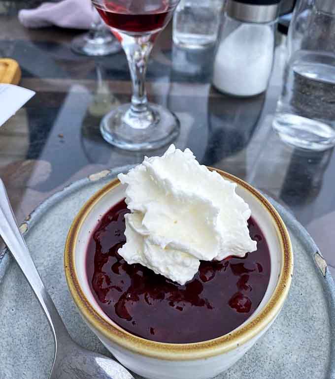 Swedish Cream topped with berry compote offers the perfect light finish after a hearty meal, sweet without being cloying or making you regret your life choices.